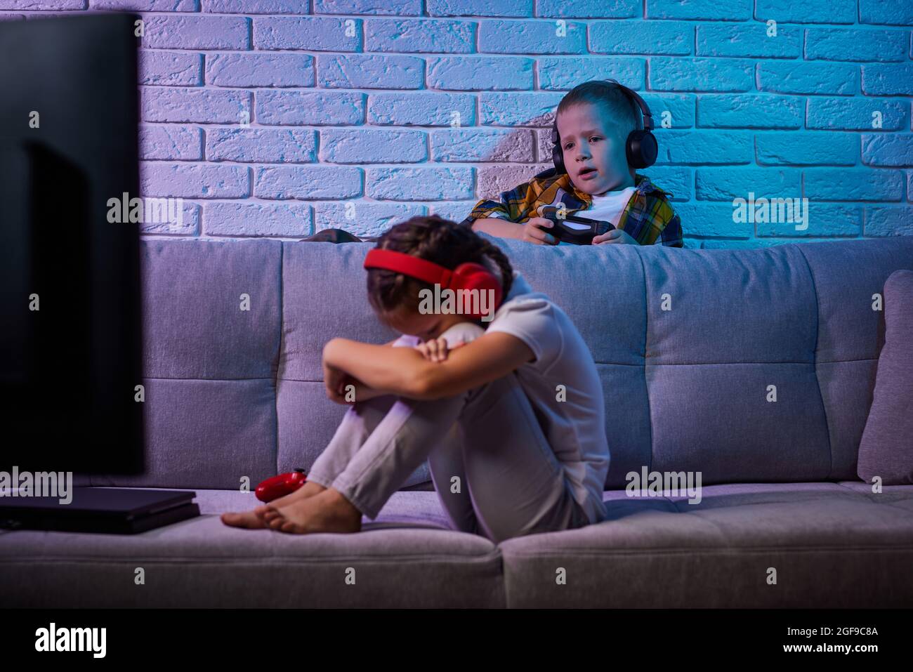 children playing video game with game console Stock Photo - Alamy