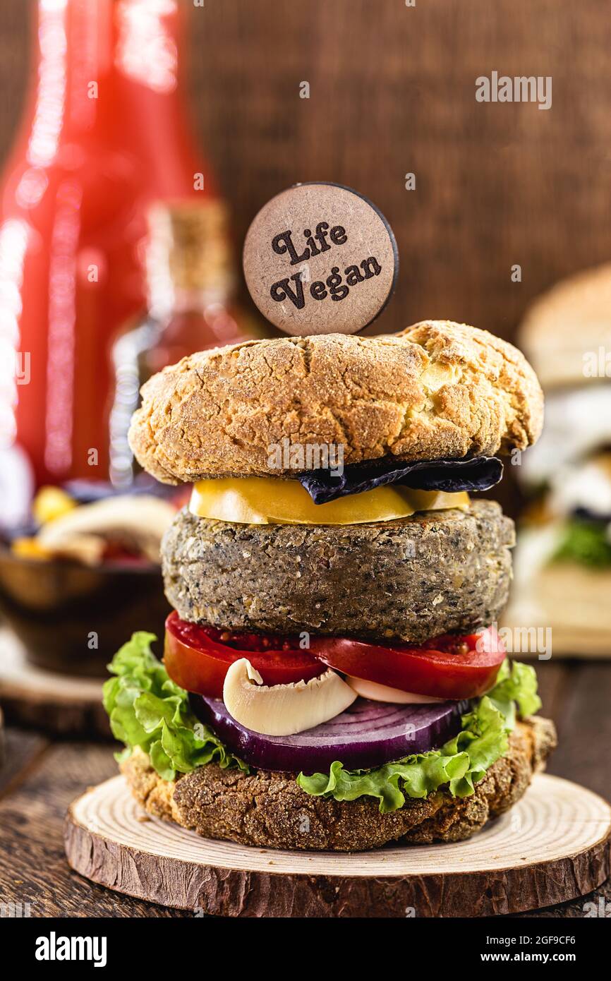vegan hamburger, with soy-based hamburger. Wooden sign written in ...