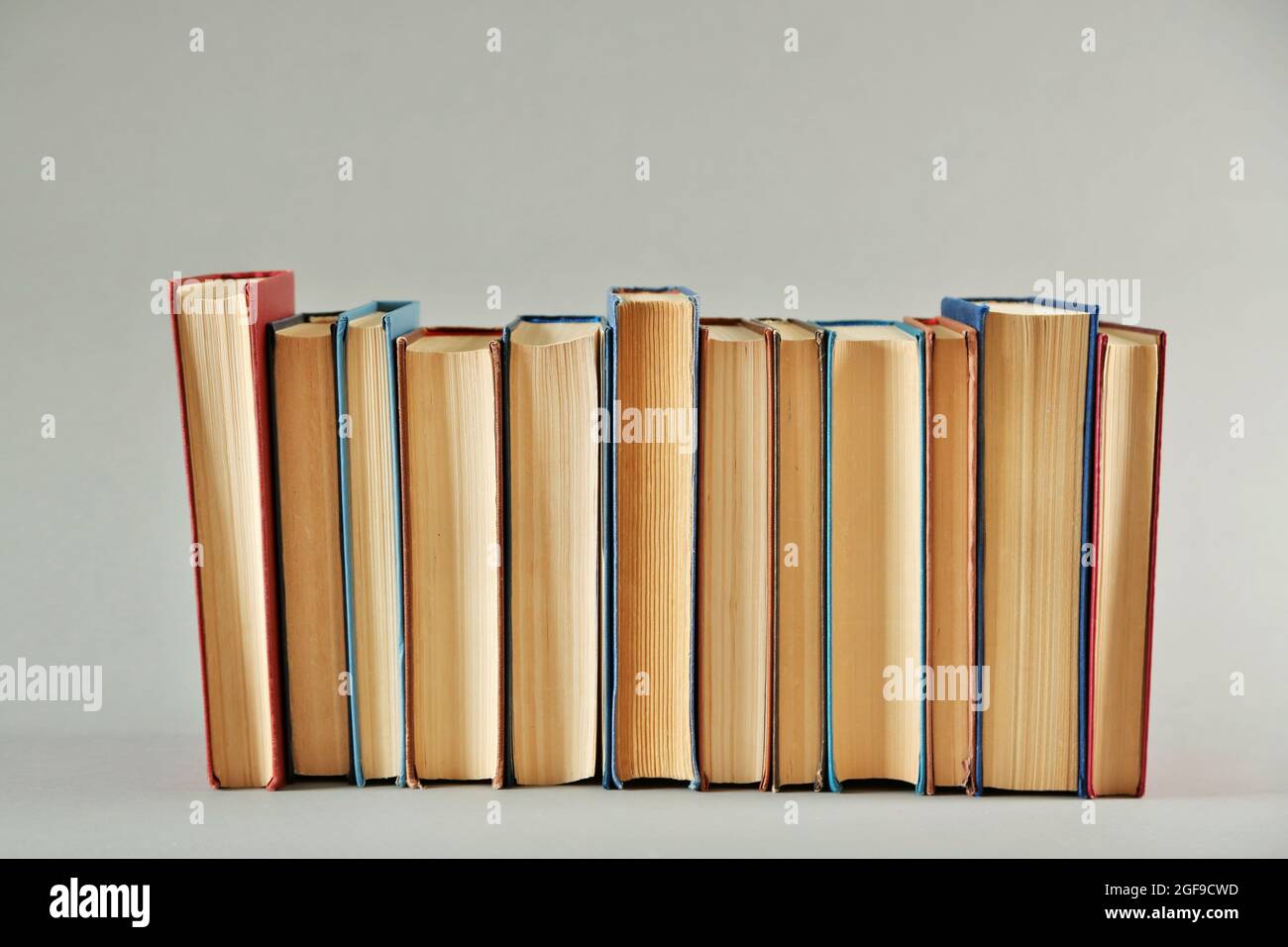 Book collection on grey background Stock Photo - Alamy