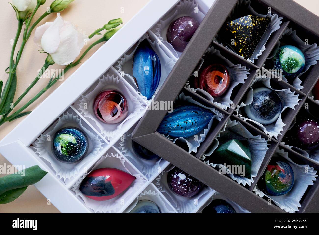 A set of handmade candies in festive packaging. Space design. Candy on ...