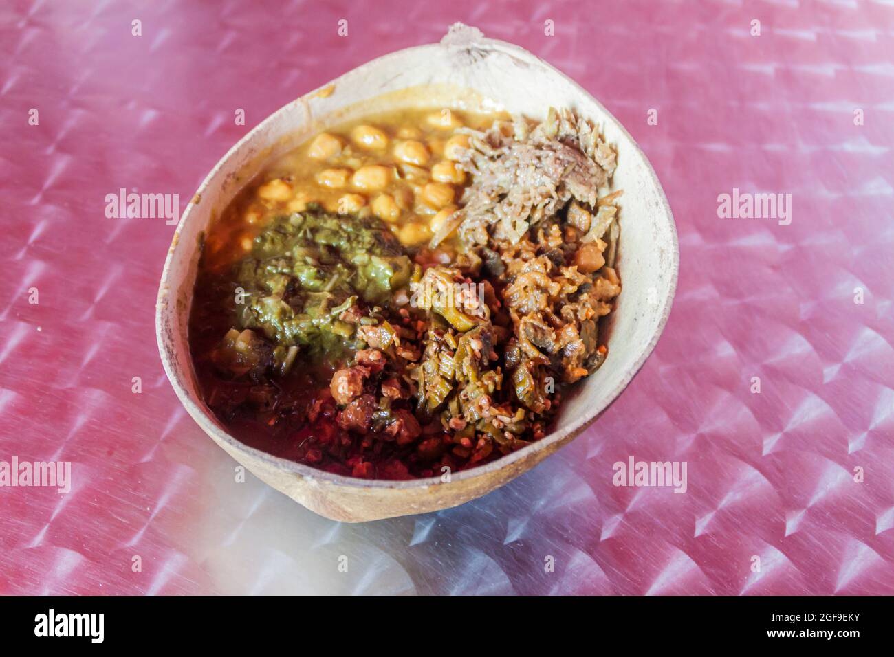 Meal consisting of beans, vegetables and achar, served in calabash ...