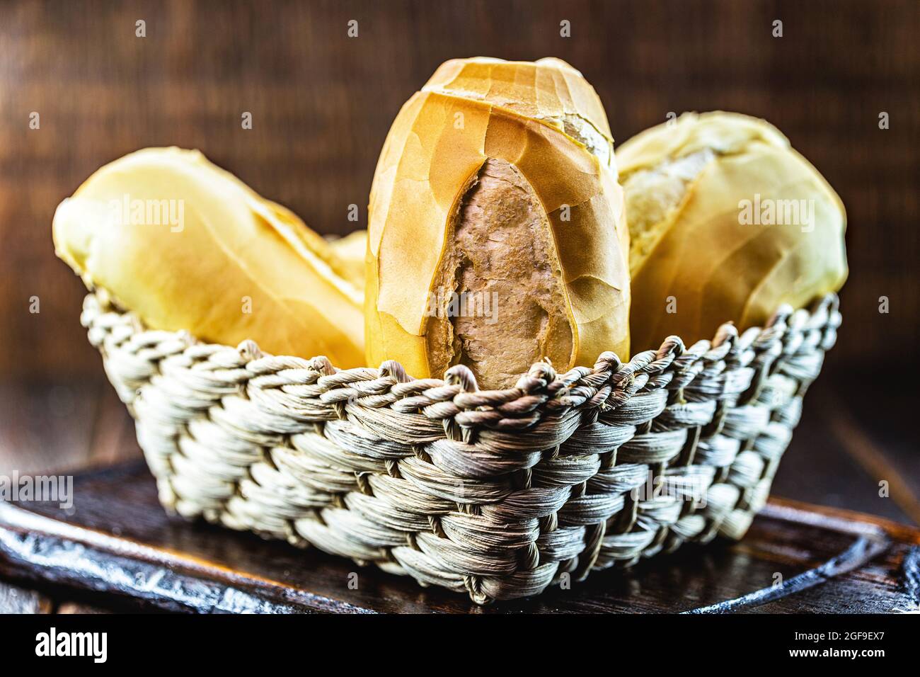 salty bread from Brazilian bakery, called French bread, in basket with ...