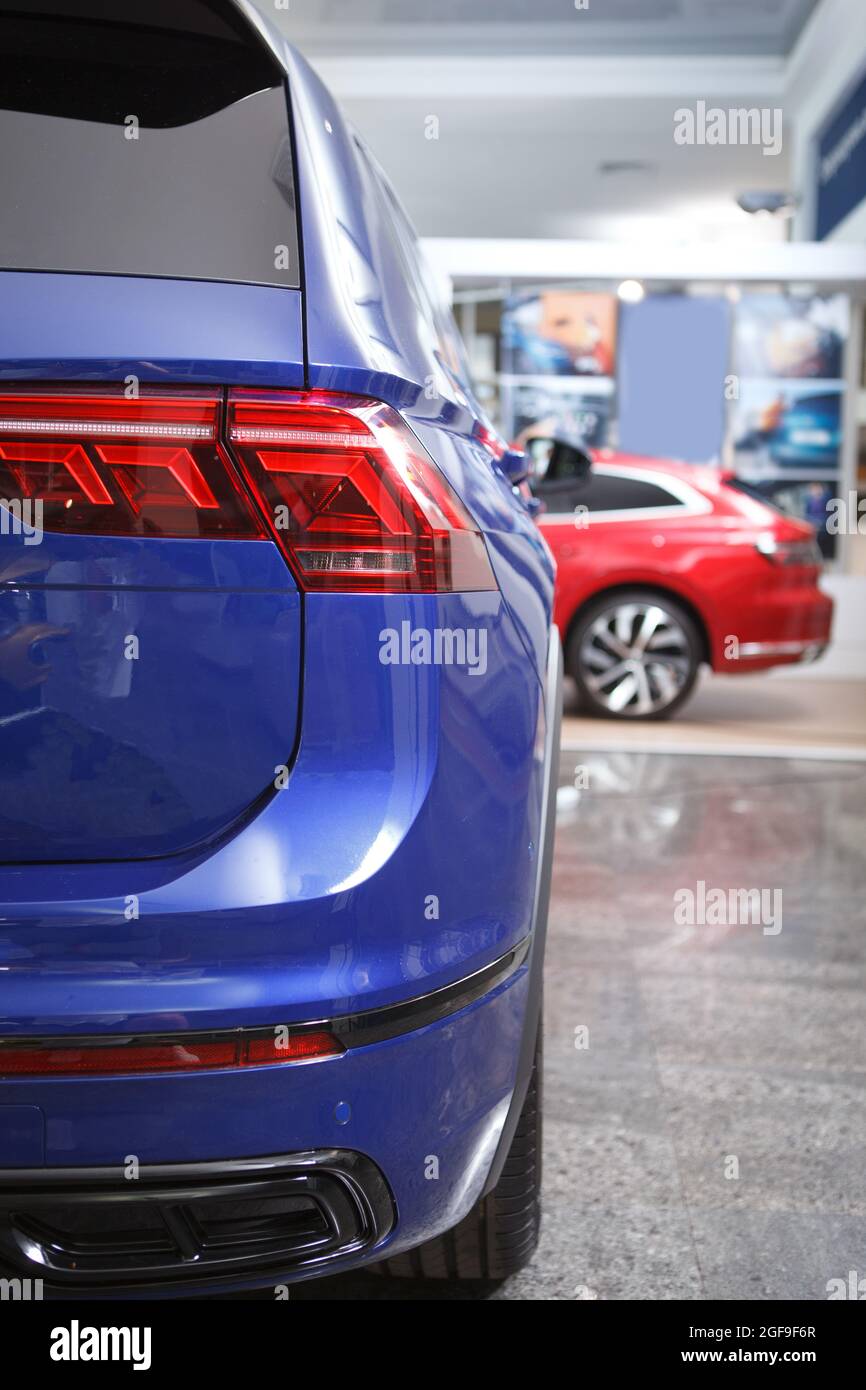 Vertical cropped shot of new automobile at car dealership salon Stock ...
