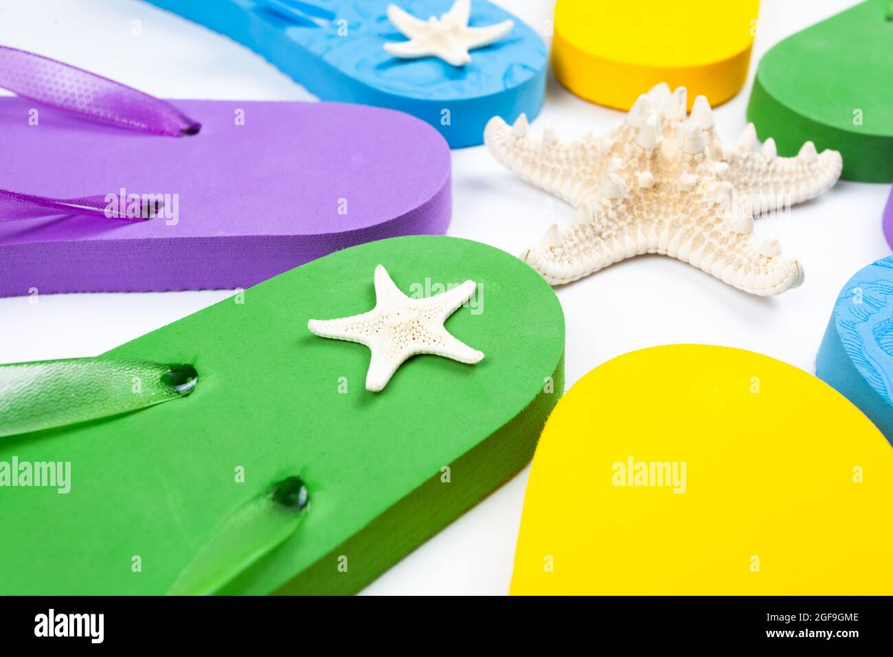 A few rubber beach flop flops and starfish, use as a background Stock ...