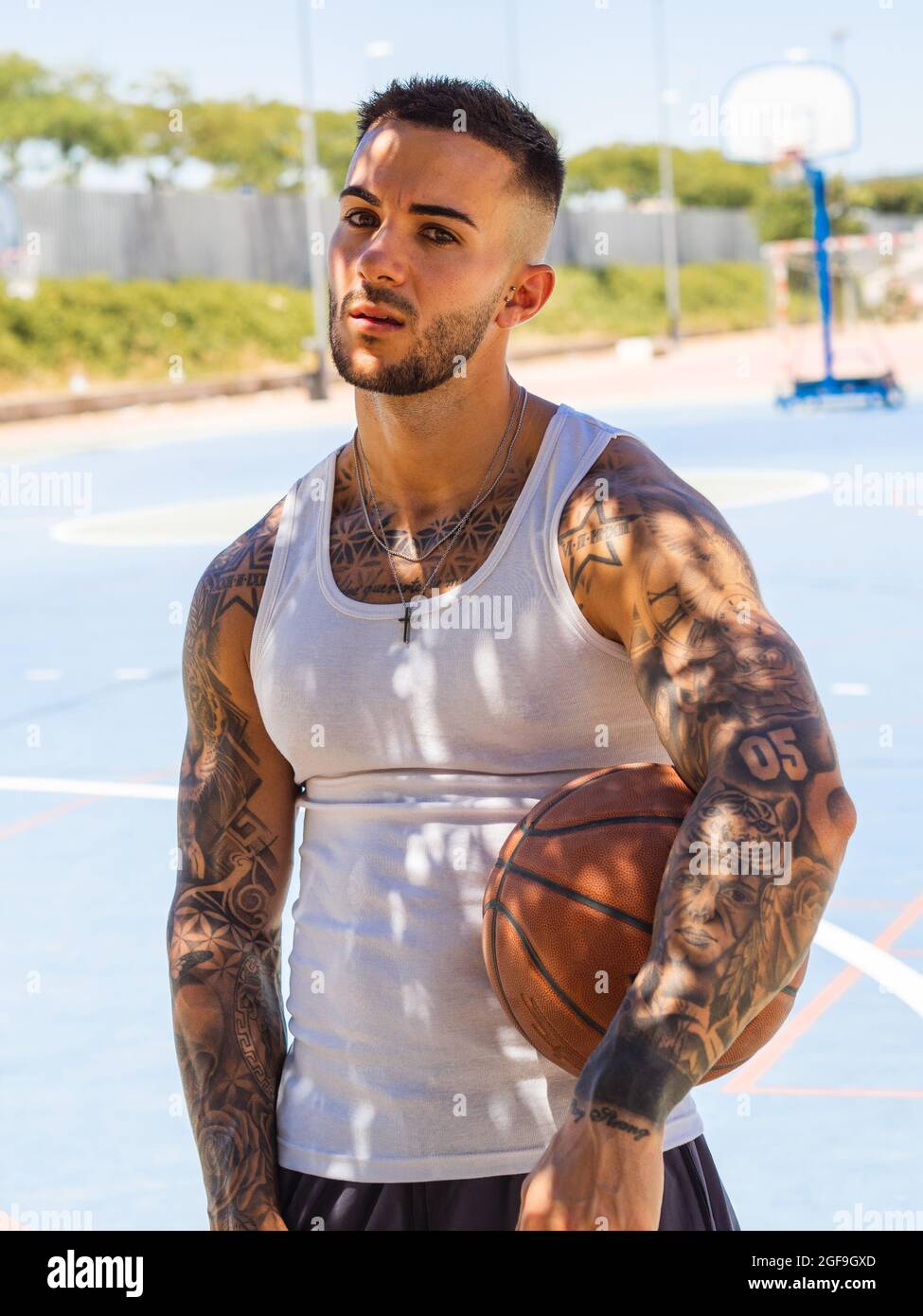 Athletic handsome Spanish basketball player training on court Stock ...