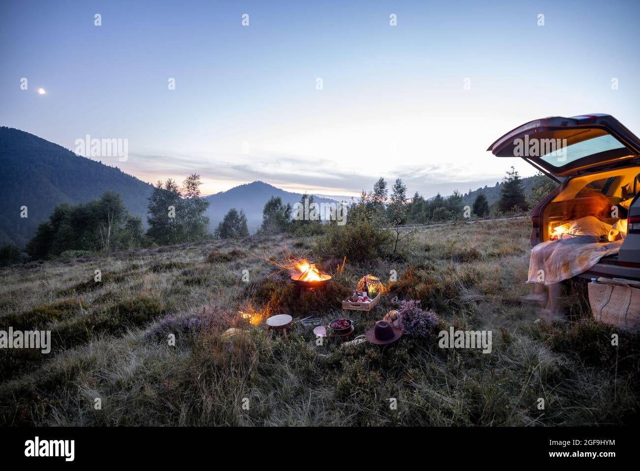 Beautiful picnic with a campfire in the mountains Stock Photo - Alamy