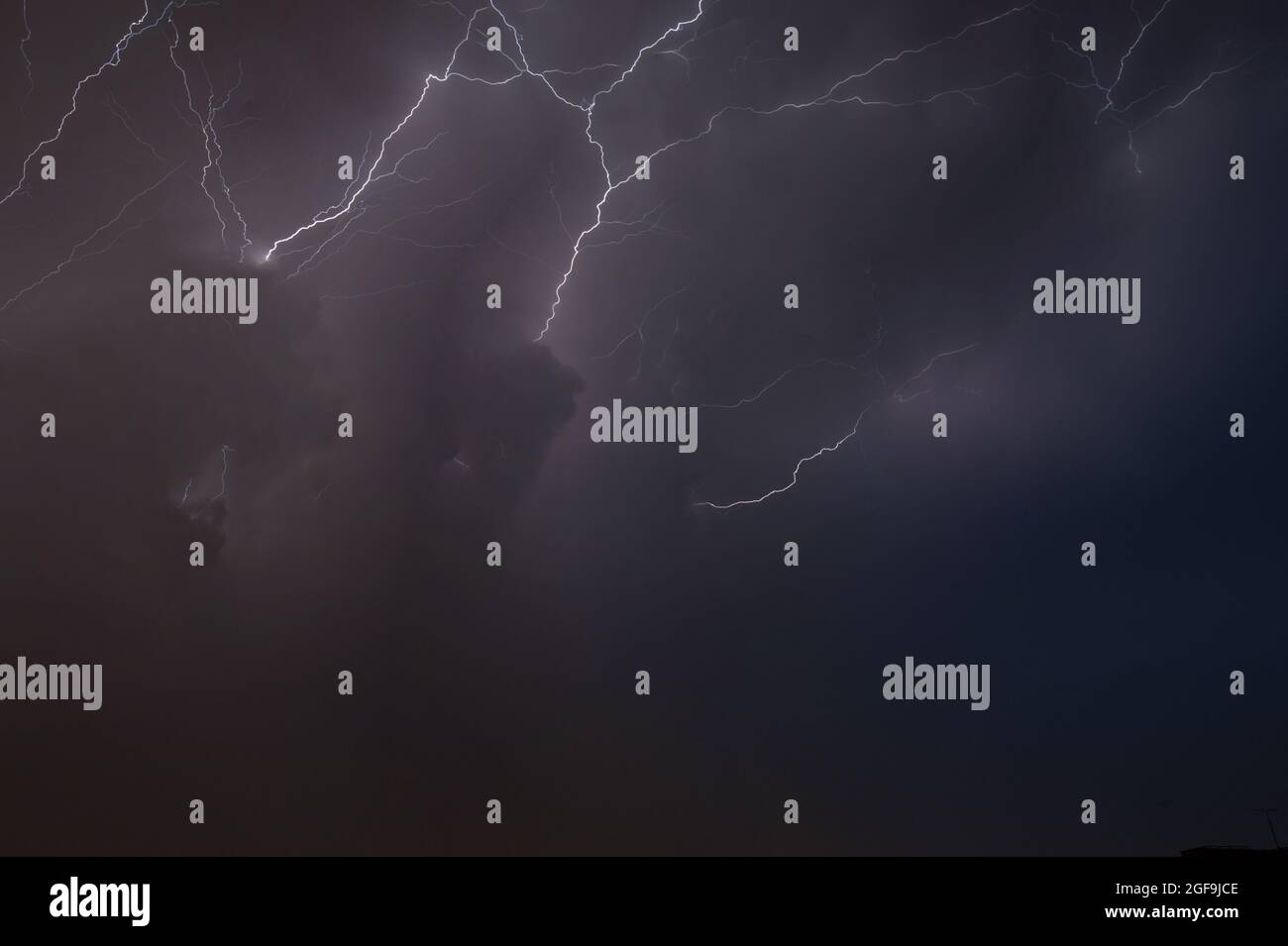 Dark lightning sky background Stock Photo - Alamy