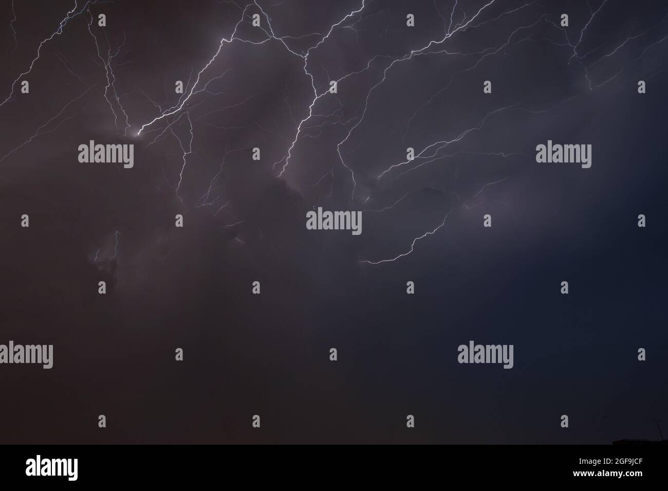 Dark lightning sky background Stock Photo - Alamy