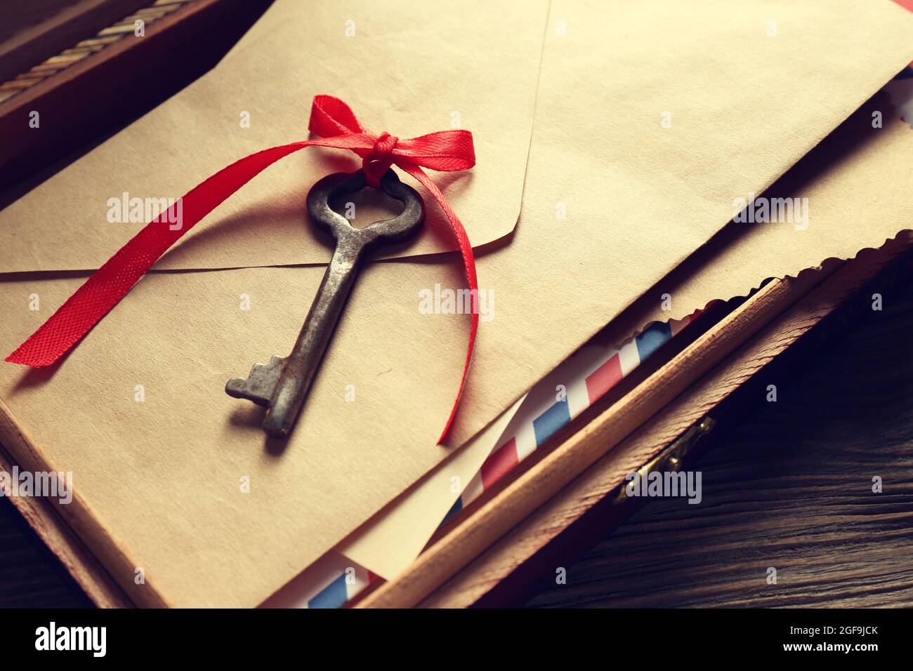 Old key with envelopes on wooden table closeup Stock Photo - Alamy