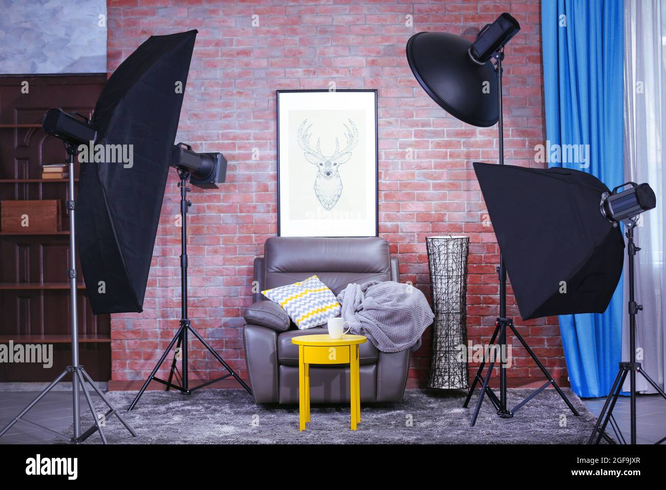 Photo studio interior on brick wall background Stock Photo - Alamy