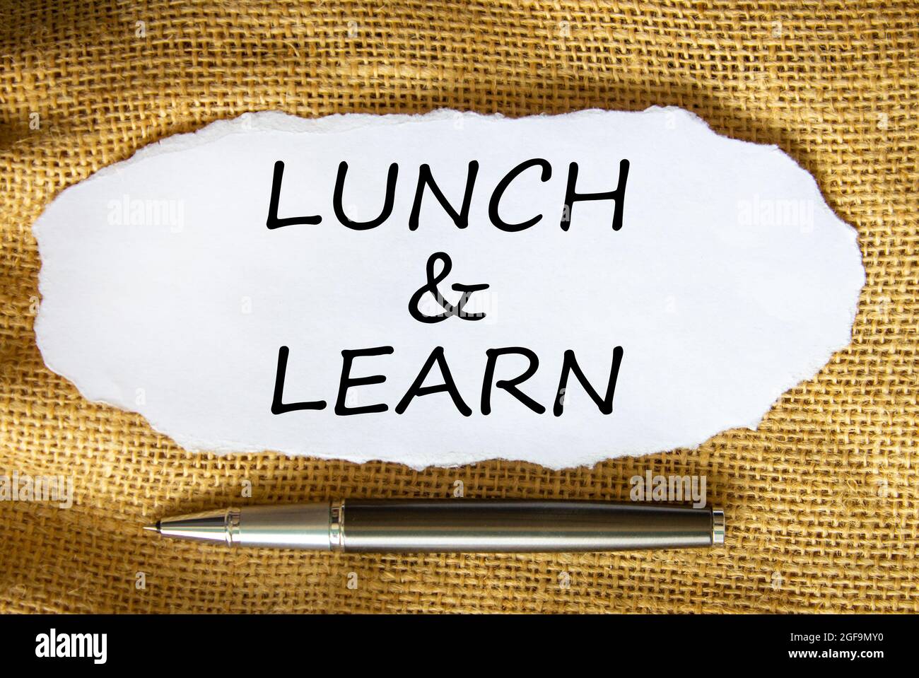 Lunch and learn symbol. Words 'Lunch and learn' on white paper. Black ...
