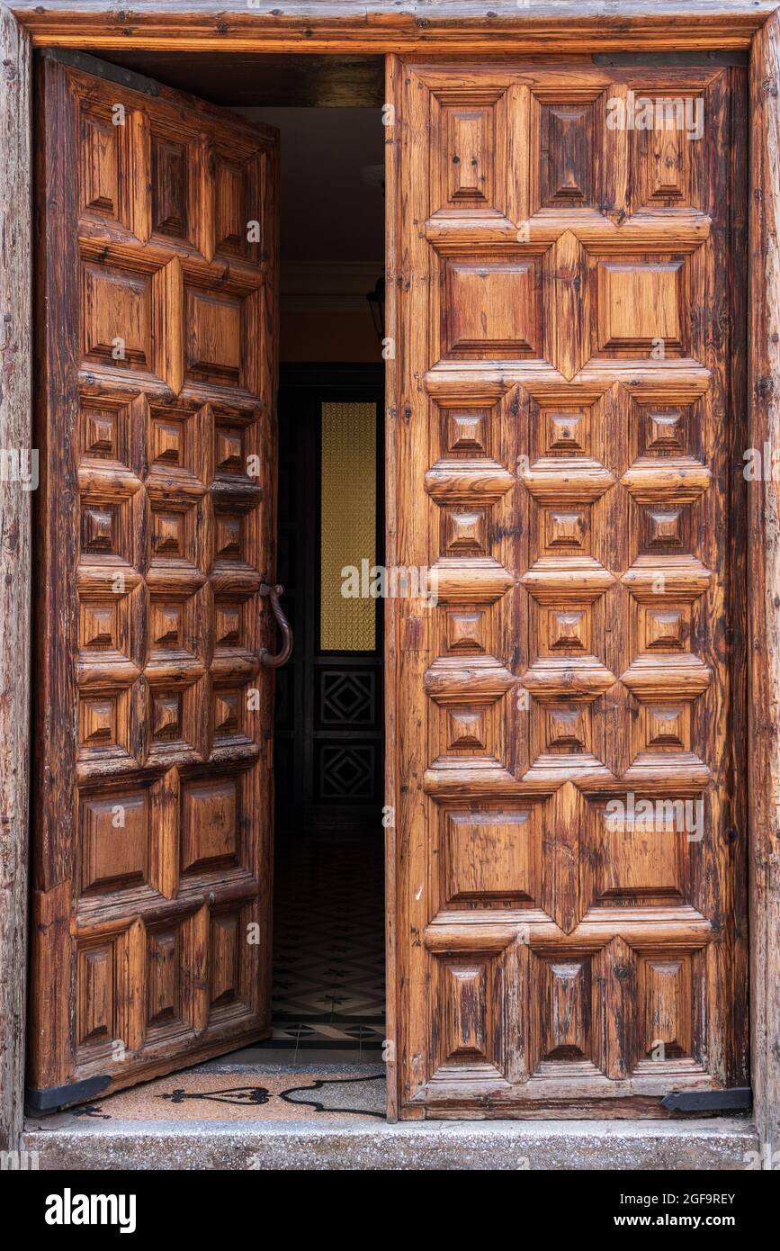 An ajar massive antique wooden door. Close-up Stock Photo - Alamy