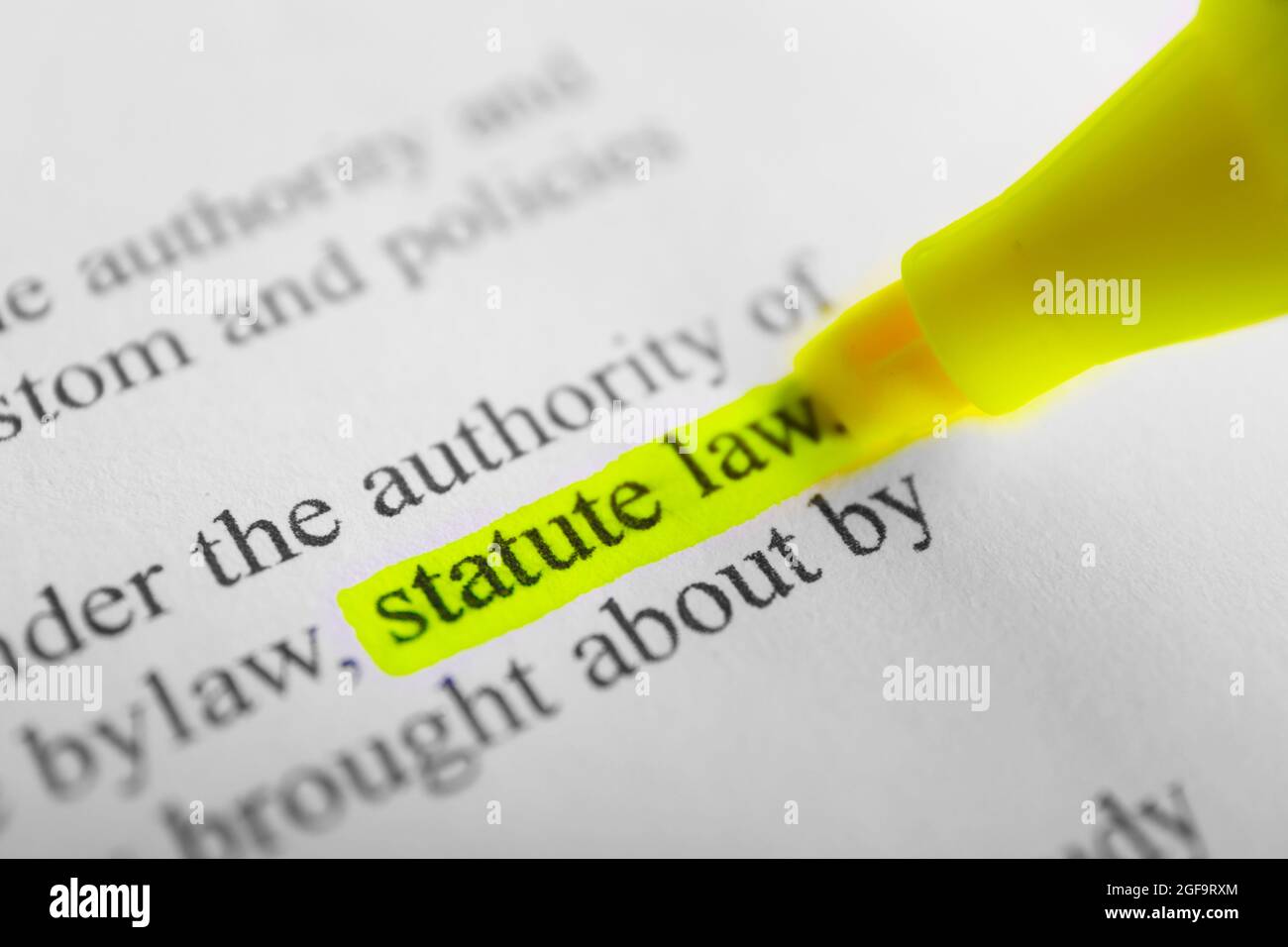 Words Statue law highlighted with a yellow marker Stock Photo - Alamy