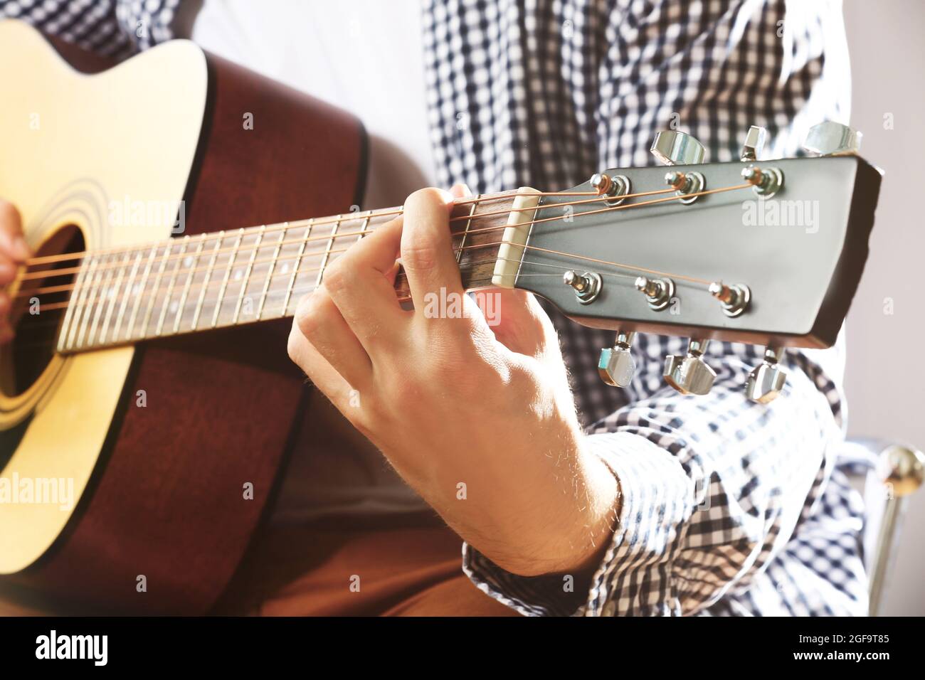 Man playing acoustic guitar Stock Photo - Alamy