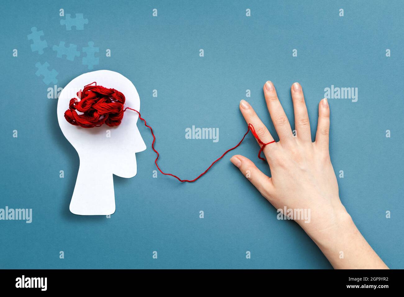 Mental health. Silhouette of a paper human head with tangled red ...