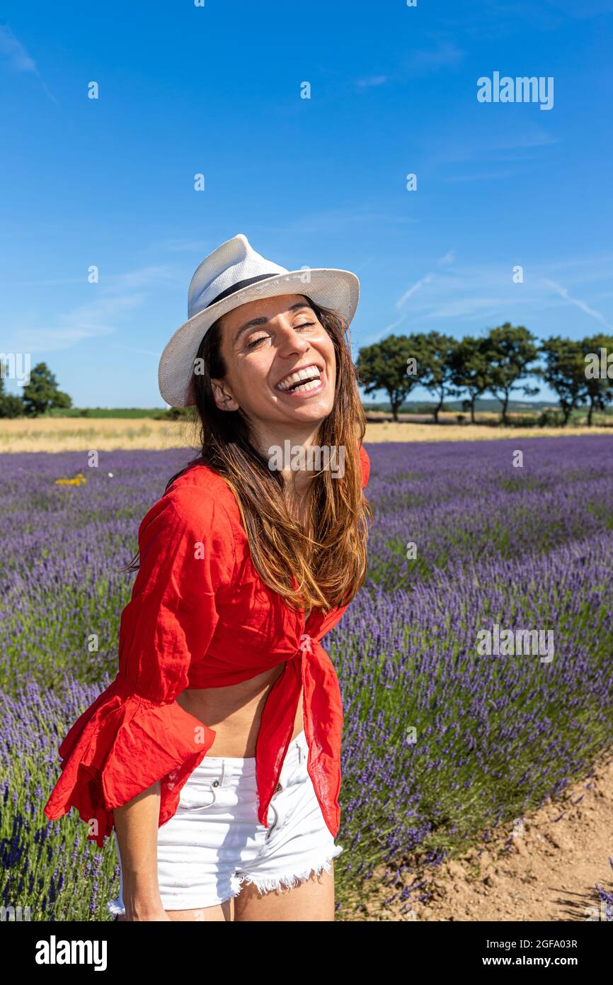 Woman wearing red shorts hi-res stock photography and images - Alamy