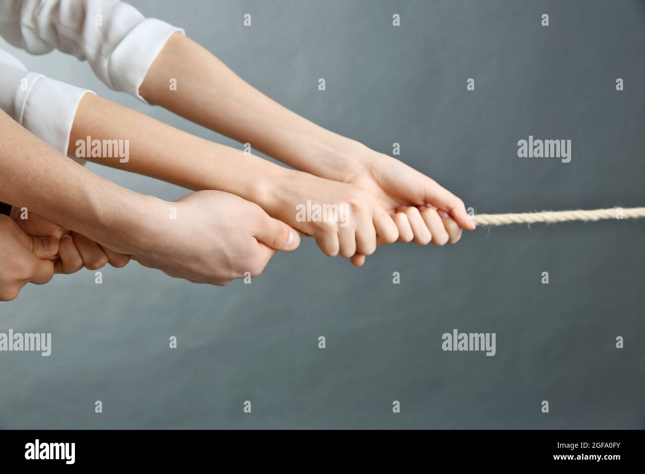 Rope Hands Pulling Together High Resolution Stock Photography and ...