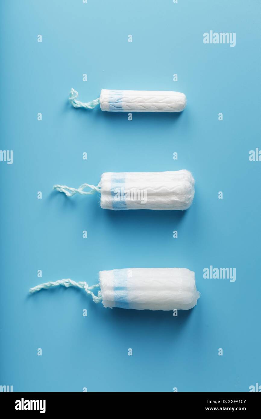 Gynecological tampons on a blue background, free space Stock Photo - Alamy