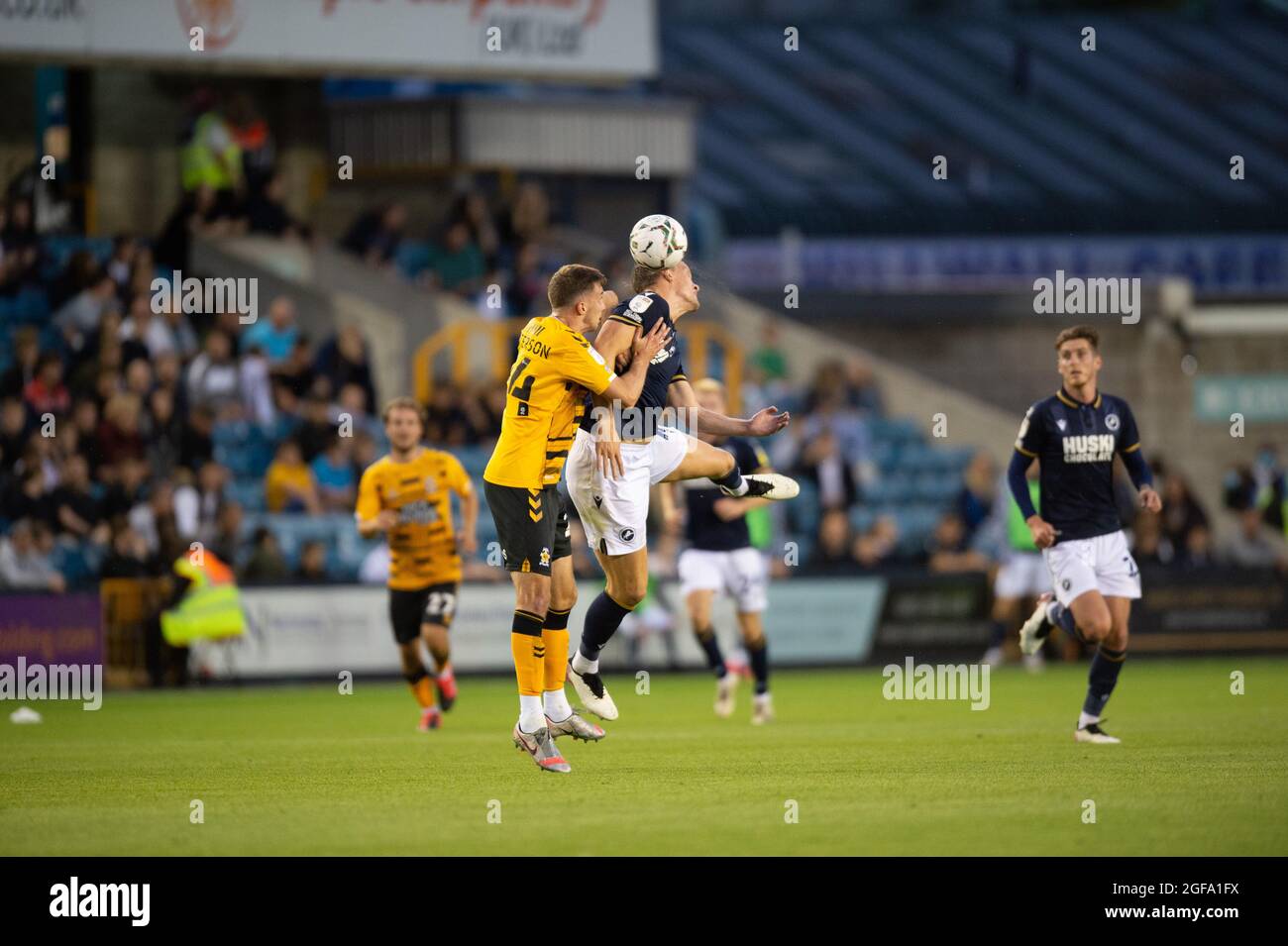 London, UK. 24th Aug, 2021. Matt Smith of Millwall wins the header from ...