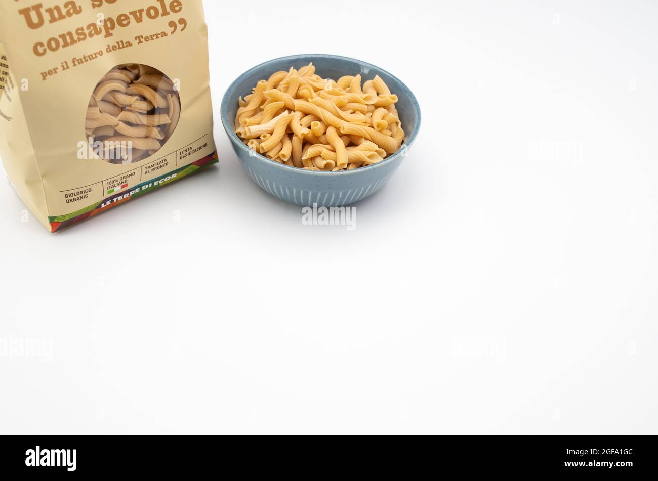 COMO, ITALY - Aug 24, 2021: shot of italian torchiette pasta in a blue ...