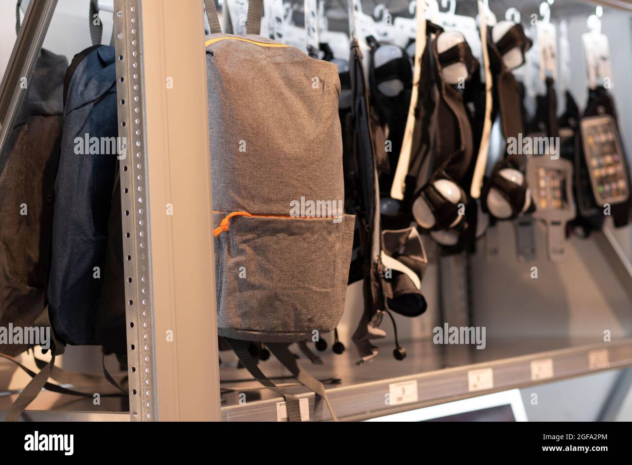 Backpacks hanging on a shelf in a store. Transportation concept Stock ...