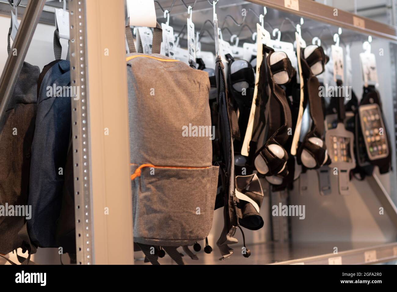 Backpacks hanging on a shelf in a store. Transportation concept Stock ...