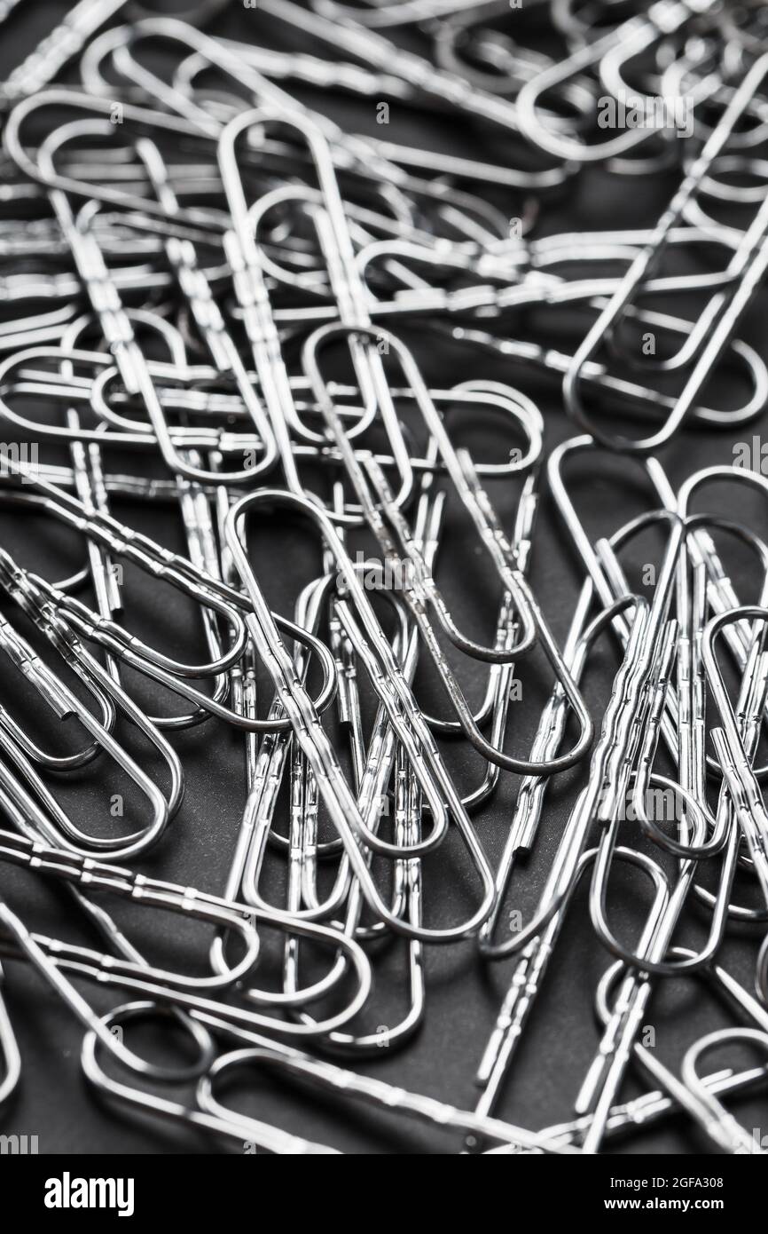 Paper clips scattered as textured background in full screen Stock Photo ...