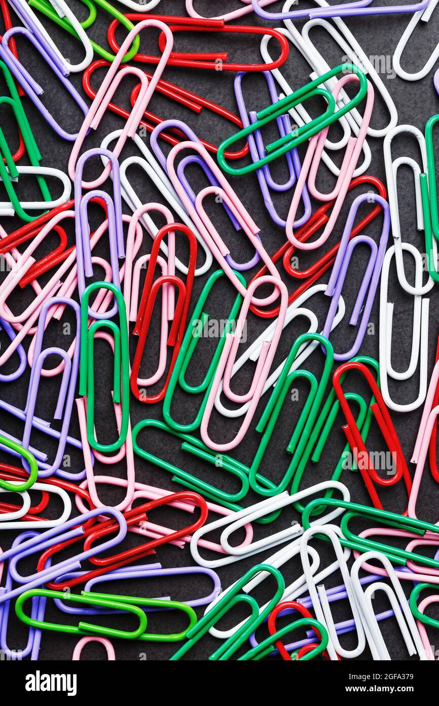 Colored paper clips textured background, full screen Stock Photo - Alamy