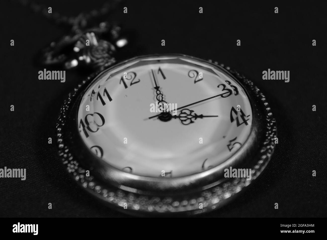 Antique pocket watch face against black background Stock Photo - Alamy