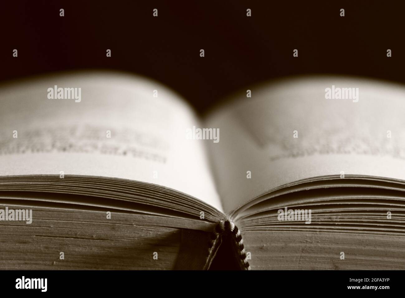 Old book opened on display Stock Photo - Alamy
