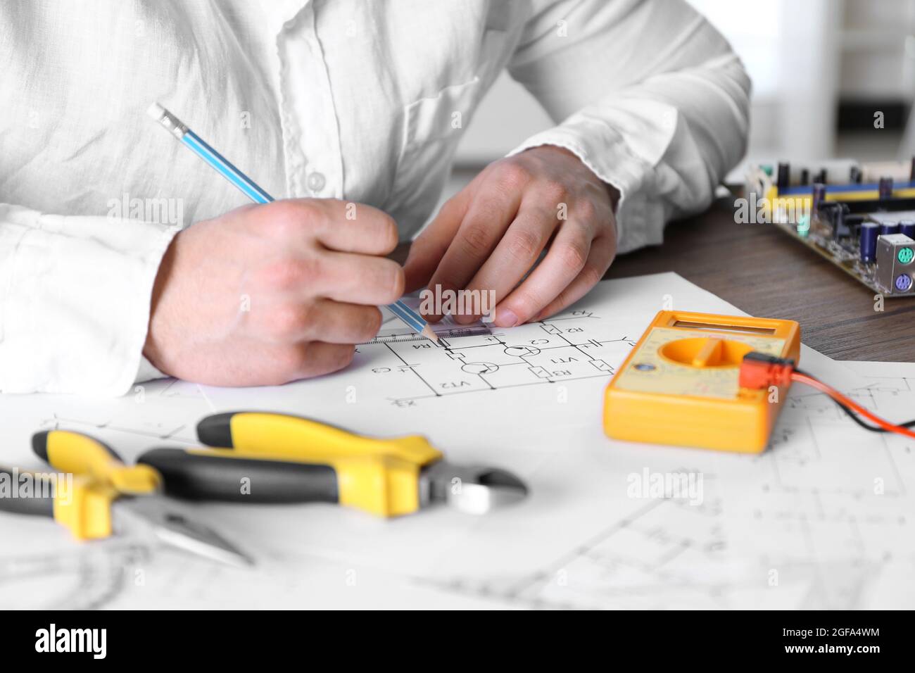 Male hands drawing electrical blueprints closeup Stock Photo - Alamy