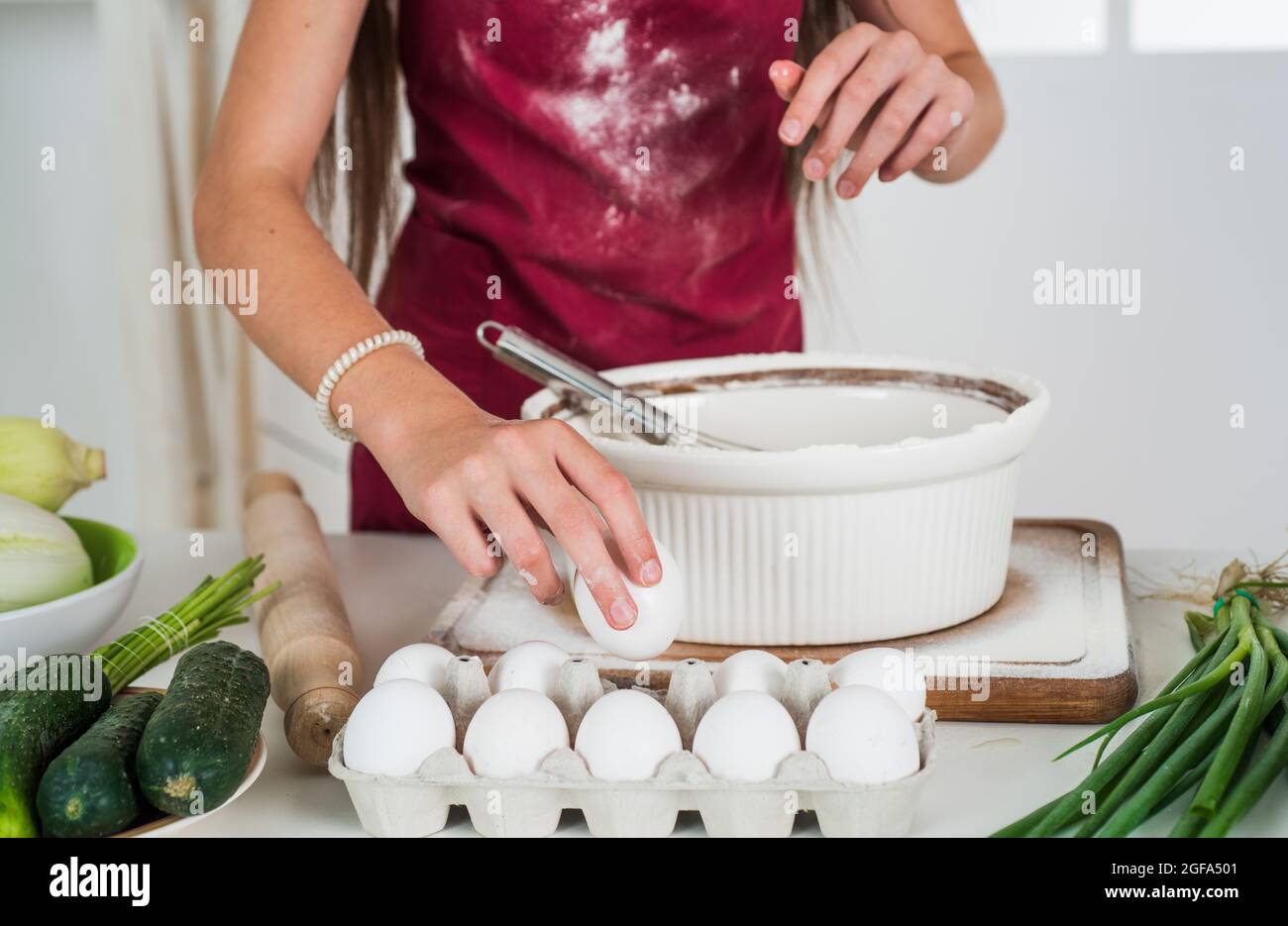 child prepare healthy food at home and wearing cook uniform ...