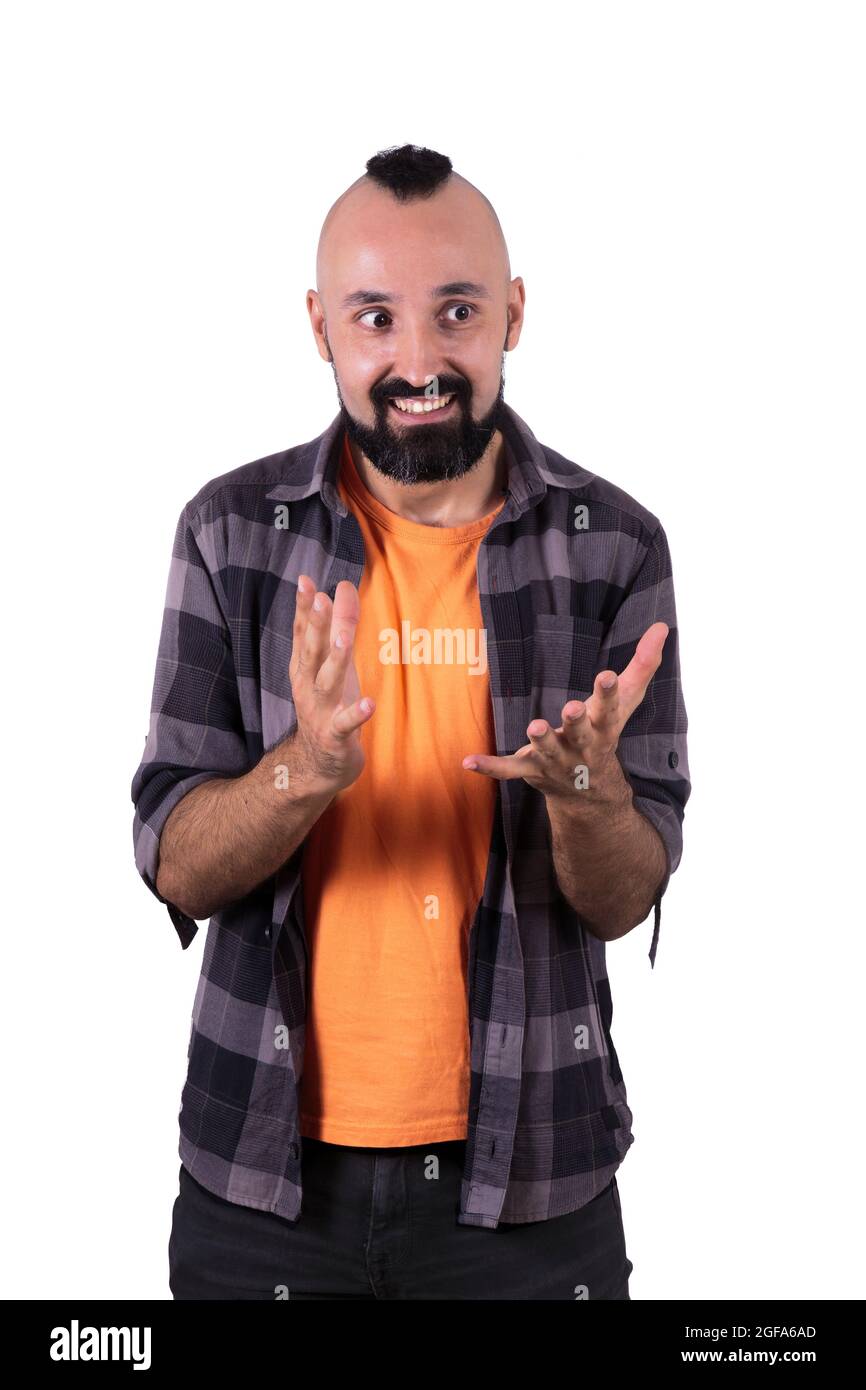 Excited hispanic young man giving an explanation Stock Photo - Alamy