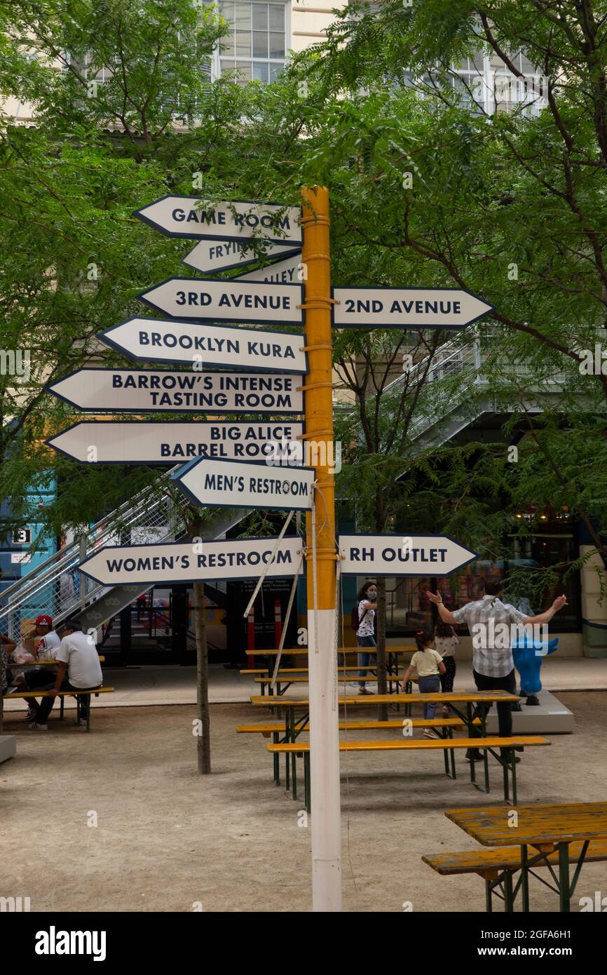 business sign in courtyard pointing to stores in industry city sunset ...