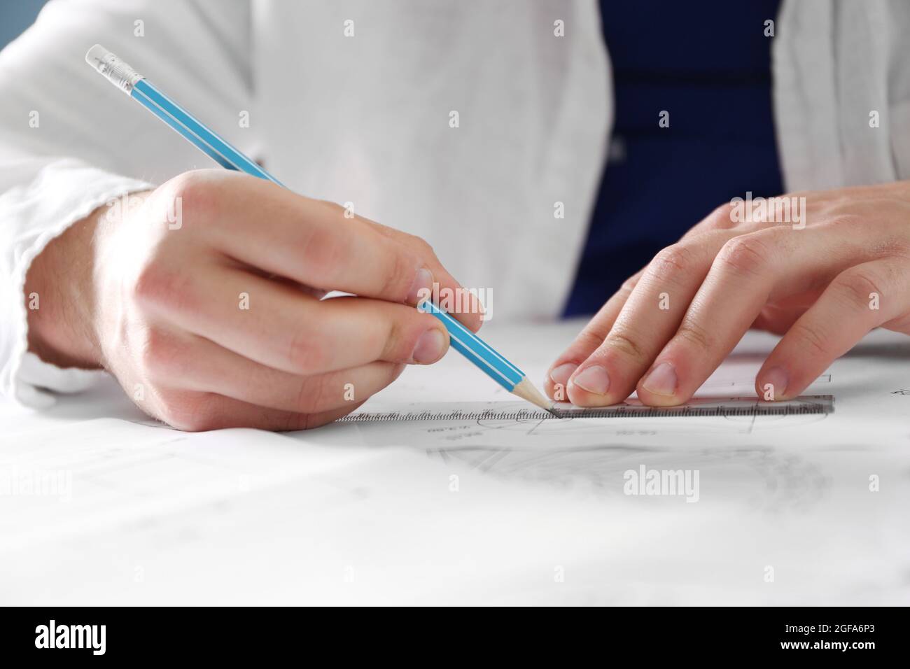 Male hands drawing engineering details blueprints closeup Stock Photo ...