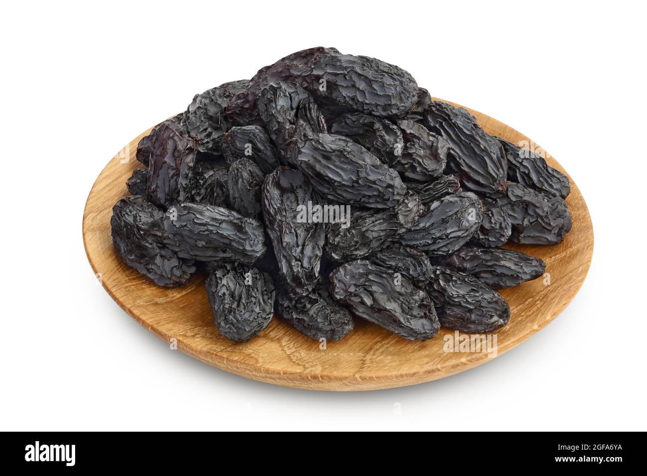 Yellow raisins in wooden bowl isolated on white background with ...
