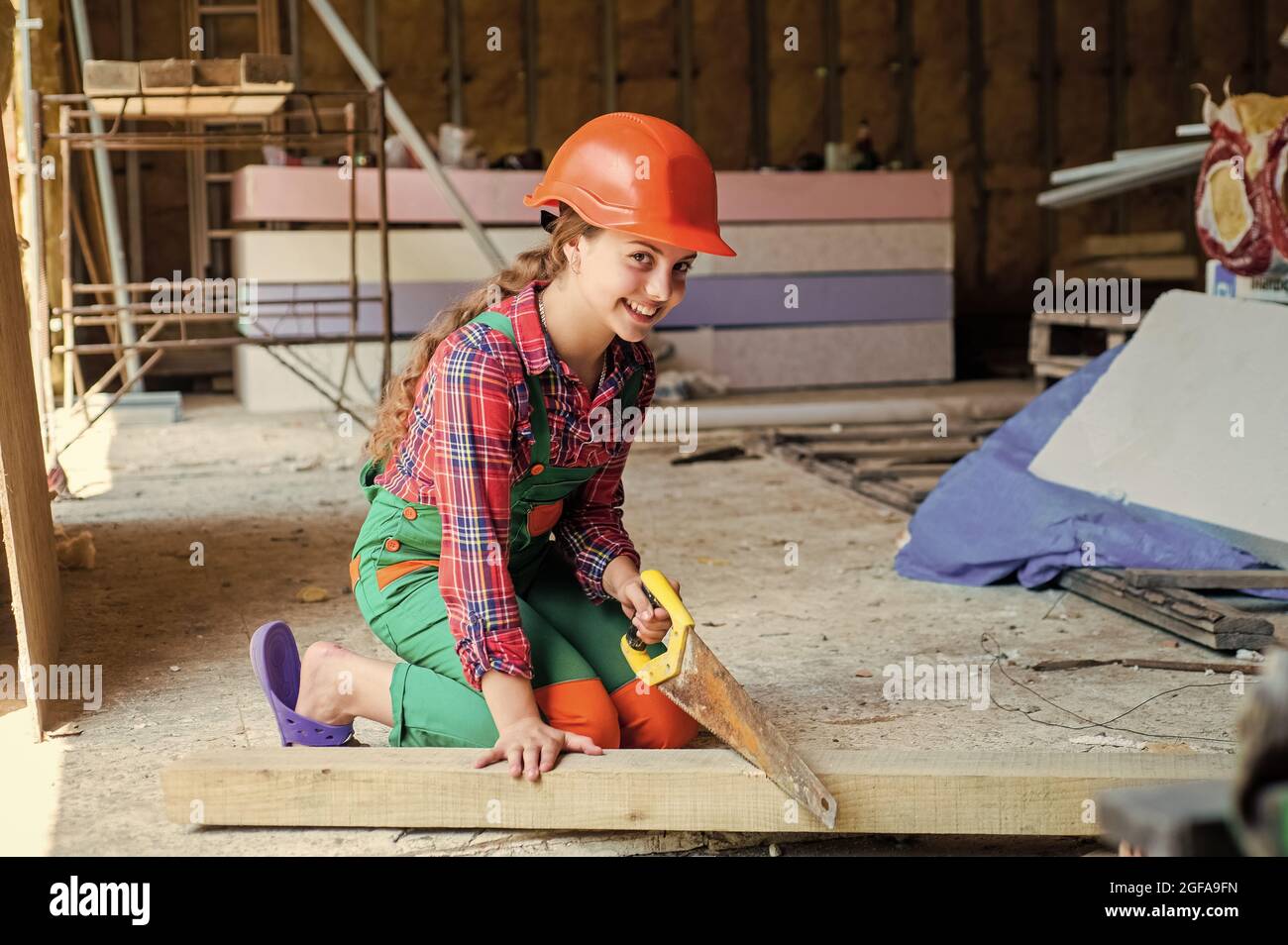 girl working with wood in workshop. carpentry and woodwork concept ...