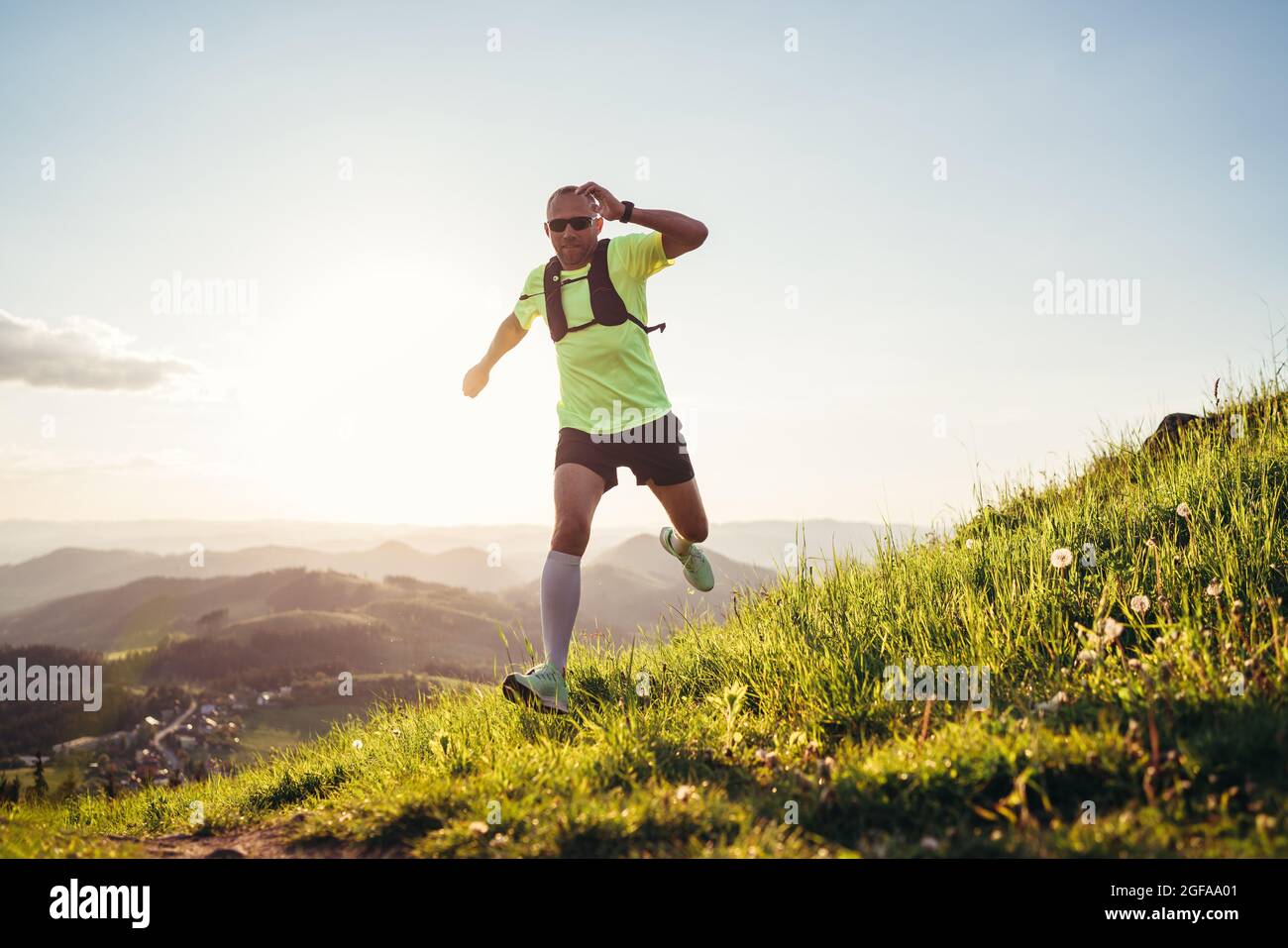 Athletic man running mountain hi-res stock photography and images - Alamy