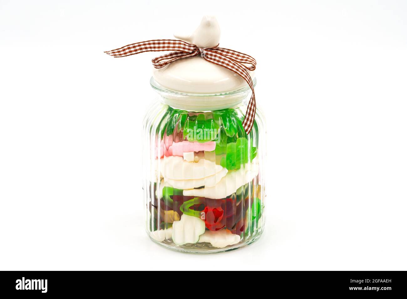 Transparent glass jar full of colorful gummies isolated on the white ...
