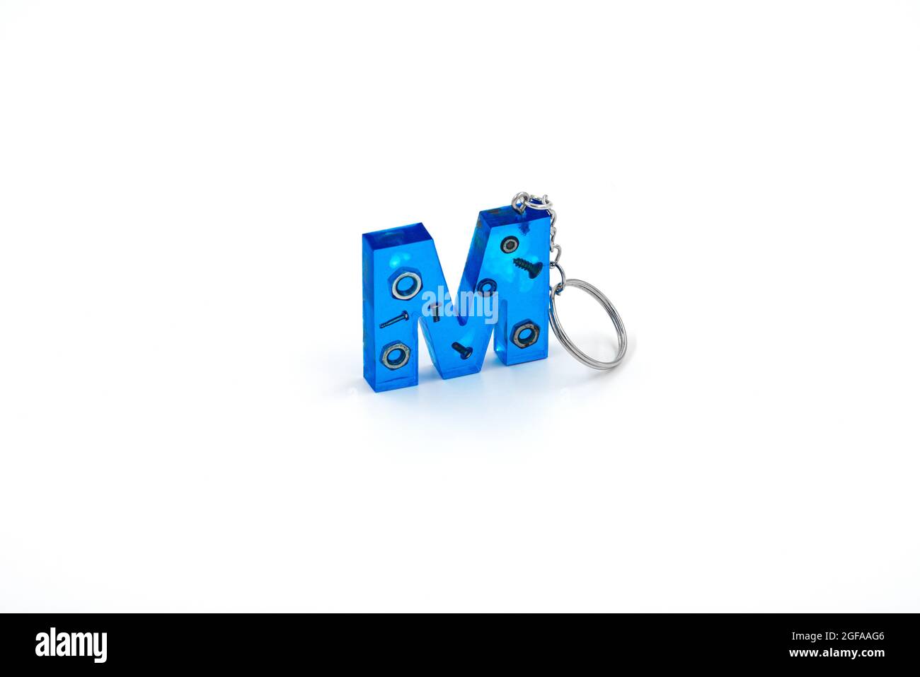 Blue letter M key chain isolated on the white background Stock Photo ...