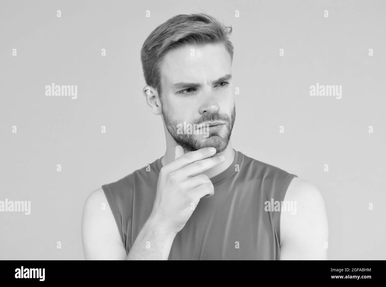 In his own style. serious man with groomed hair. male beauty standard ...