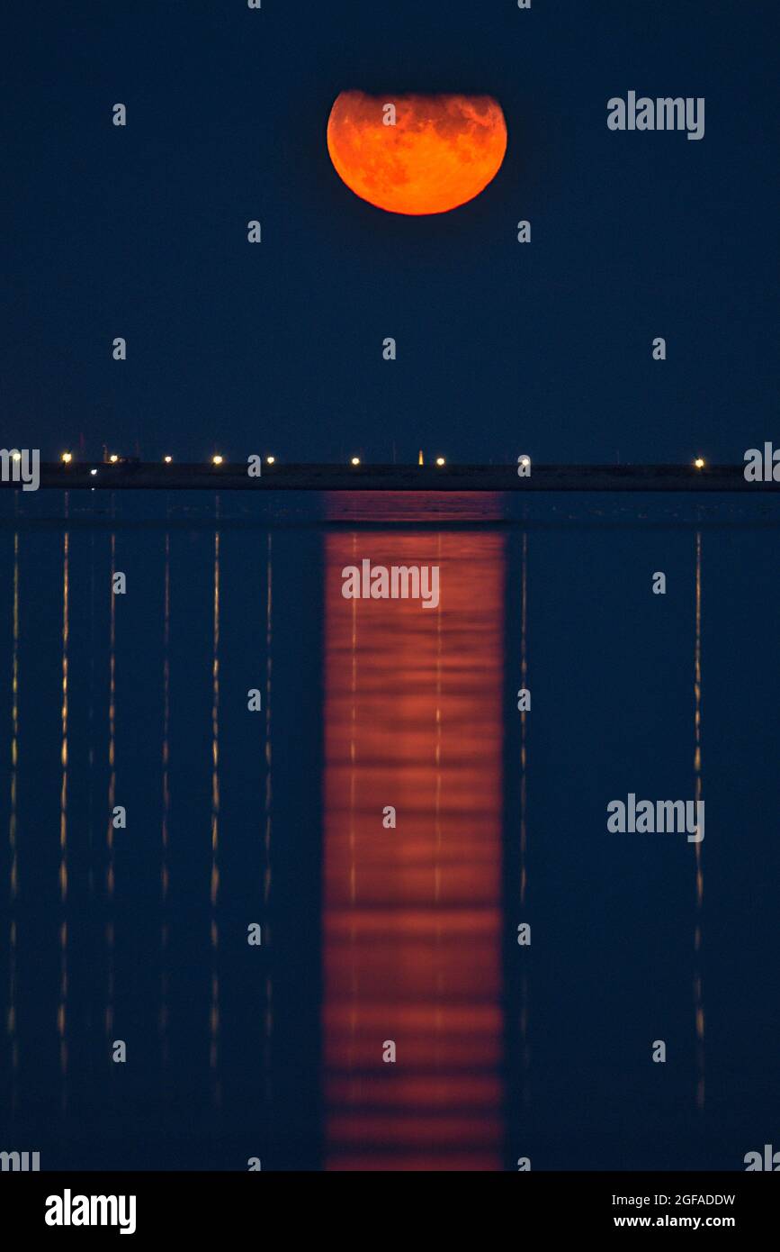 Beautiful view of rare summer full blue sturgeon Moon rising over Irish ...