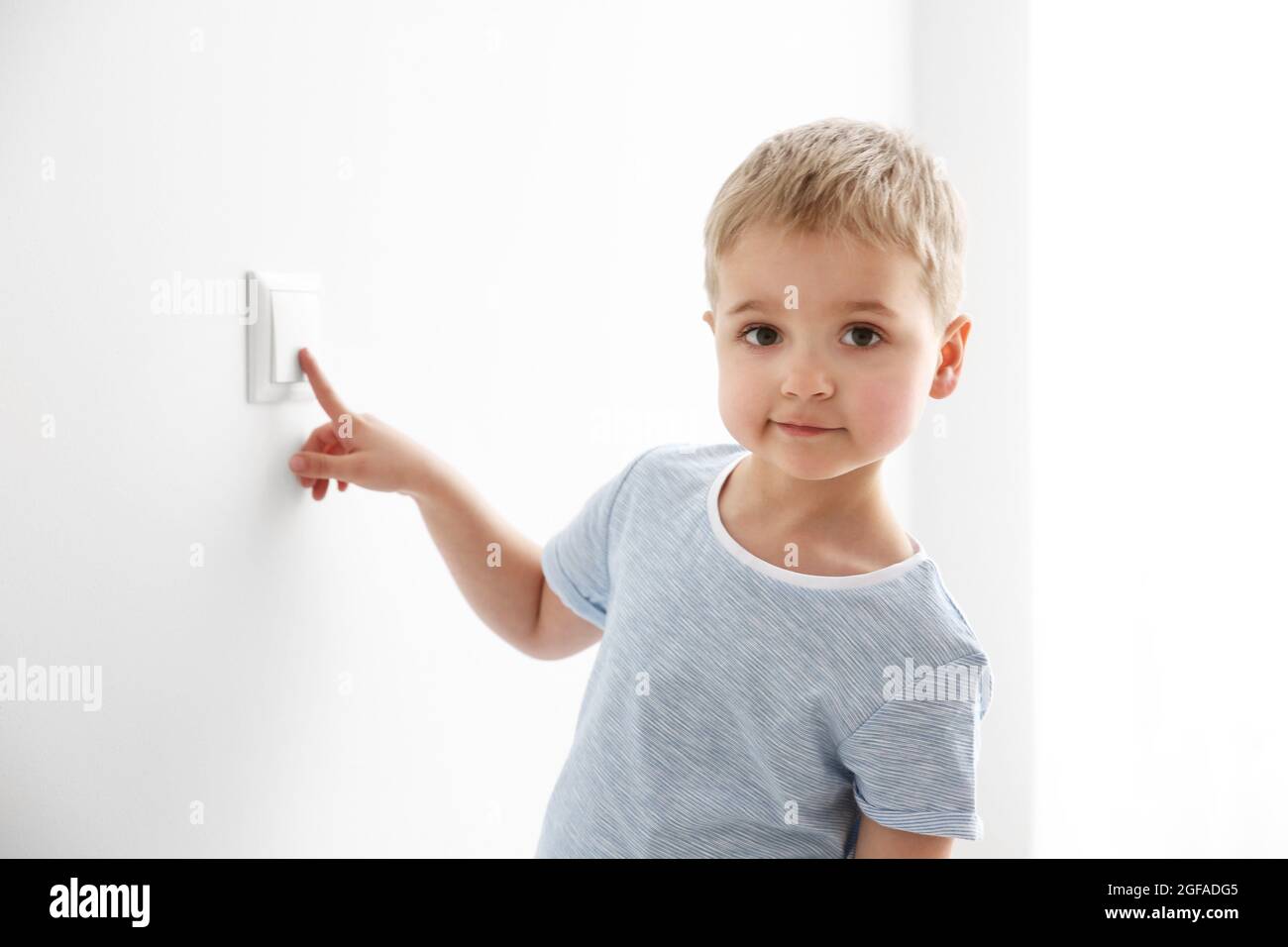 Little child playing with switch Stock Photo - Alamy