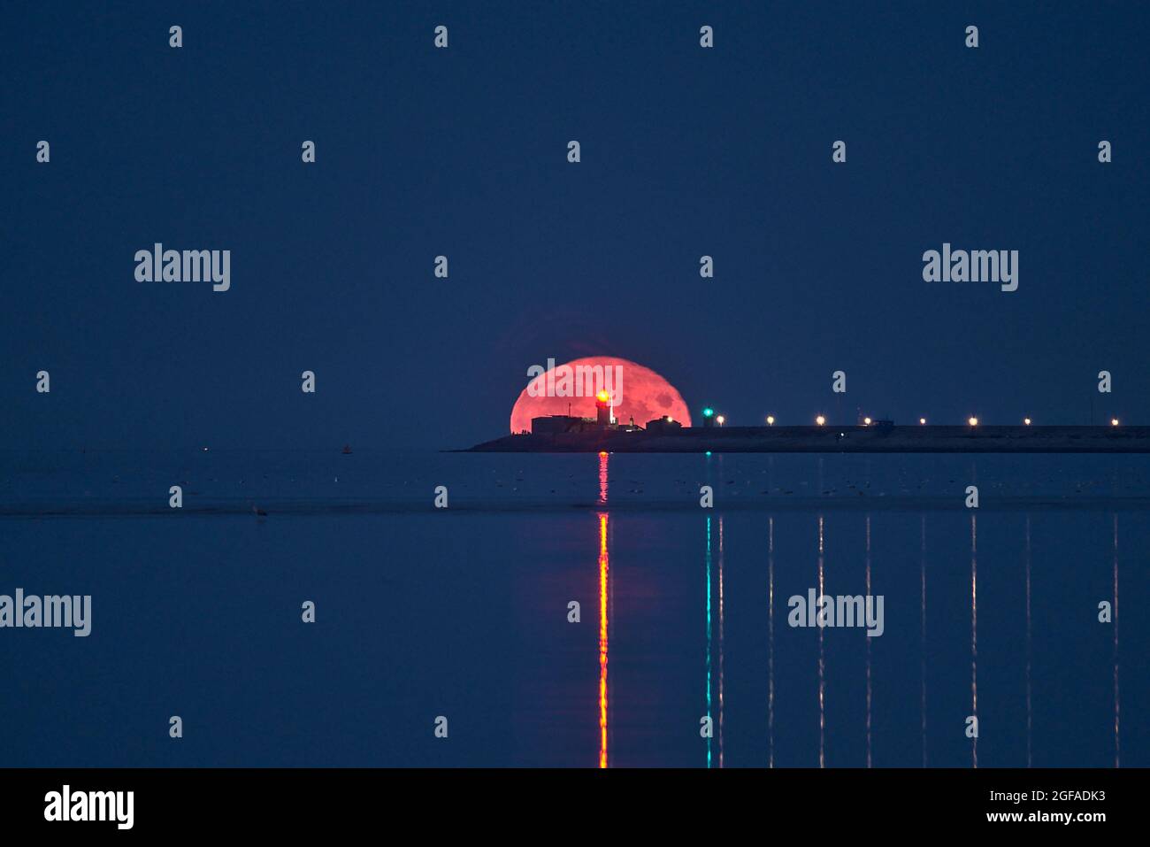 Beautiful view of rare summer full blue sturgeon Moon rising over Irish ...
