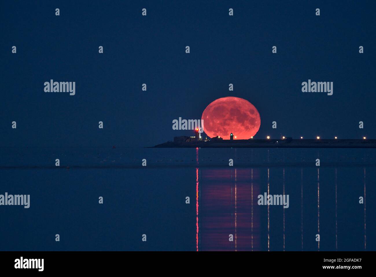 Beautiful view of rare summer full blue sturgeon Moon rising over Irish ...