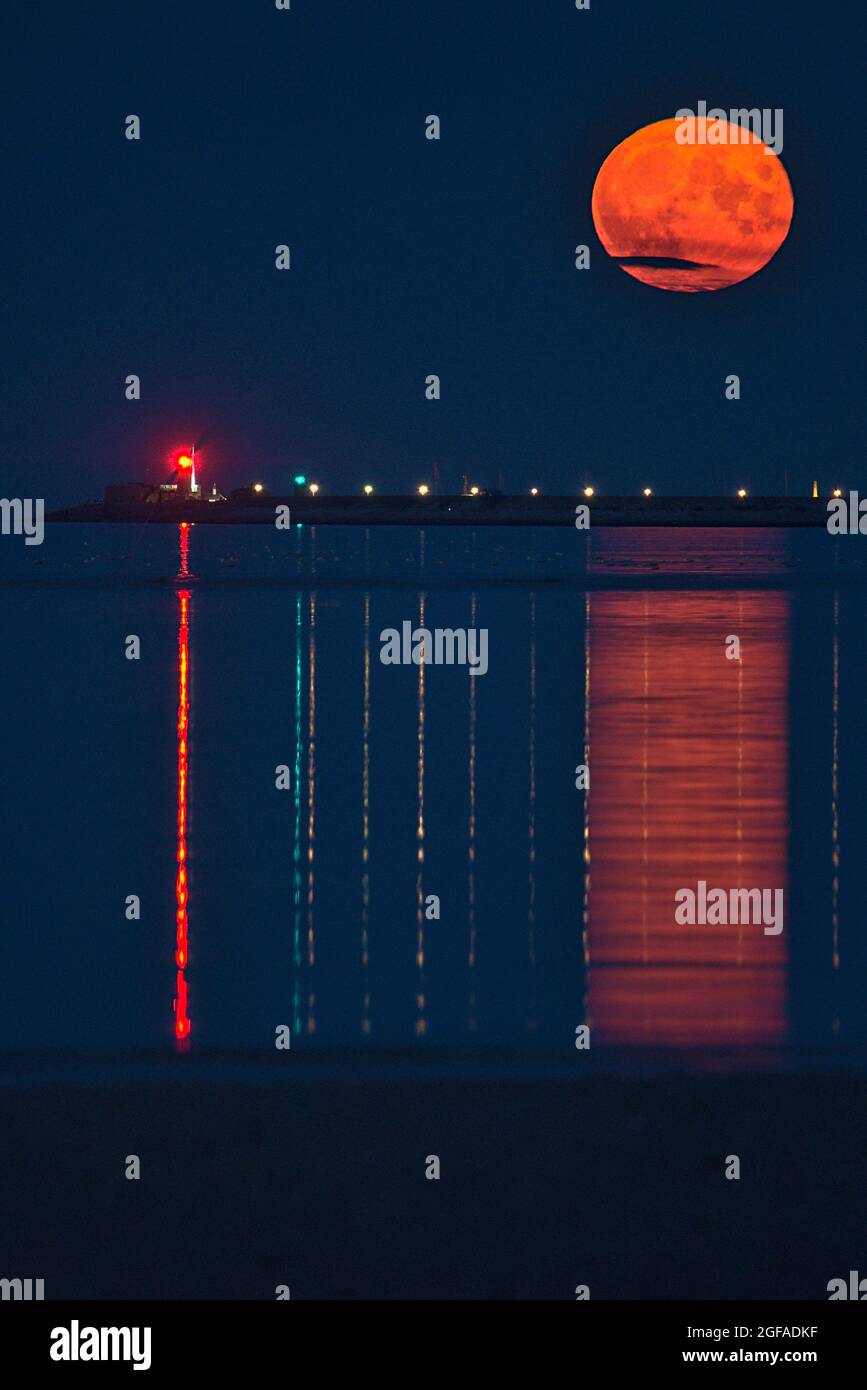 Beautiful view of rare summer full blue sturgeon Moon rising over Irish ...