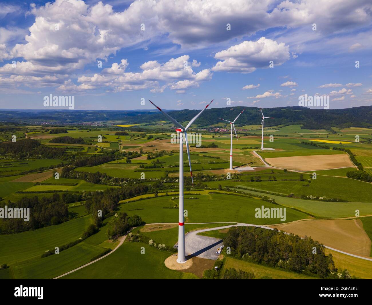 Landscape of windmills in green fields Stock Photo - Alamy