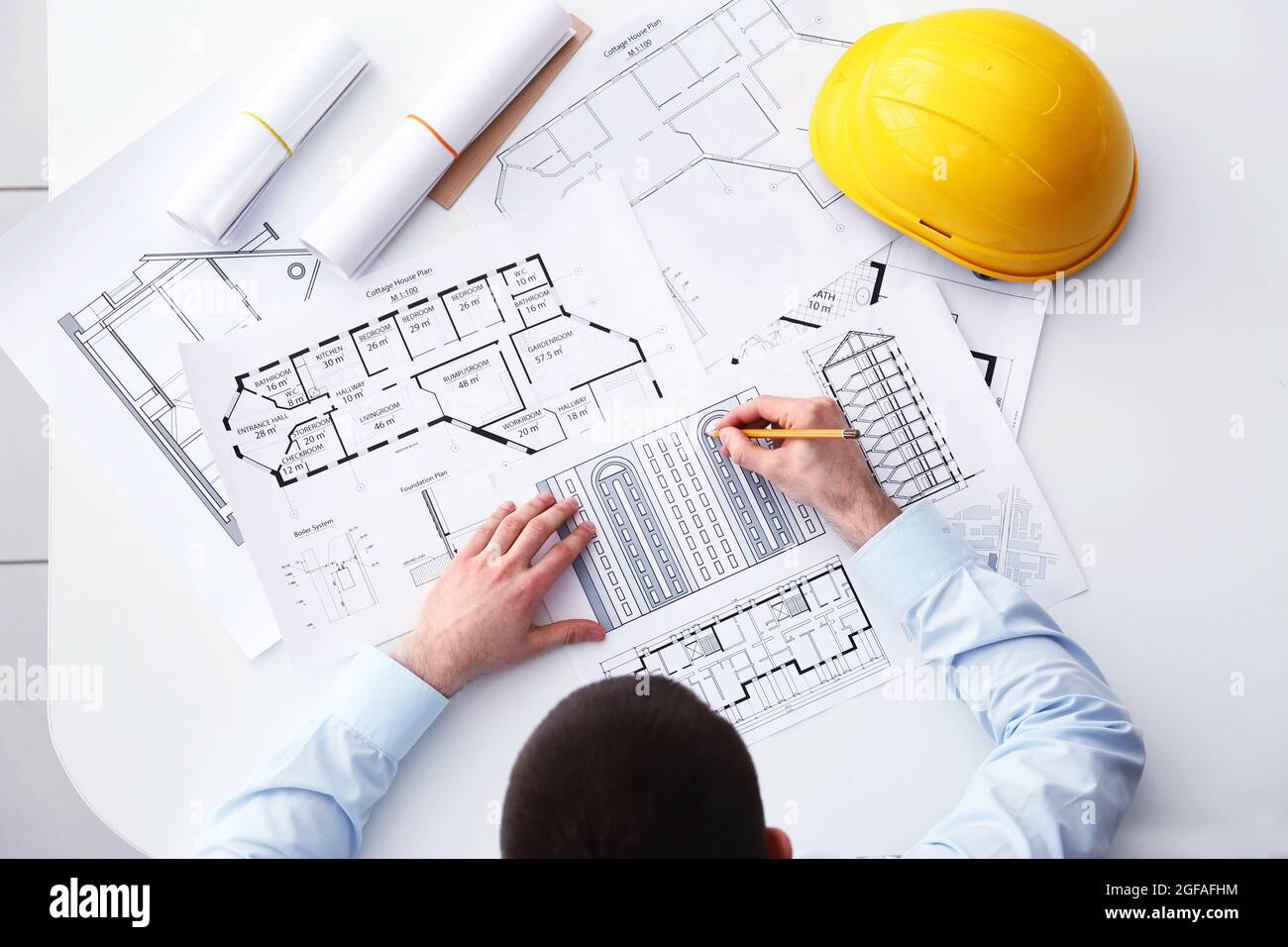 Young male construction engineer working in the office Stock Photo - Alamy