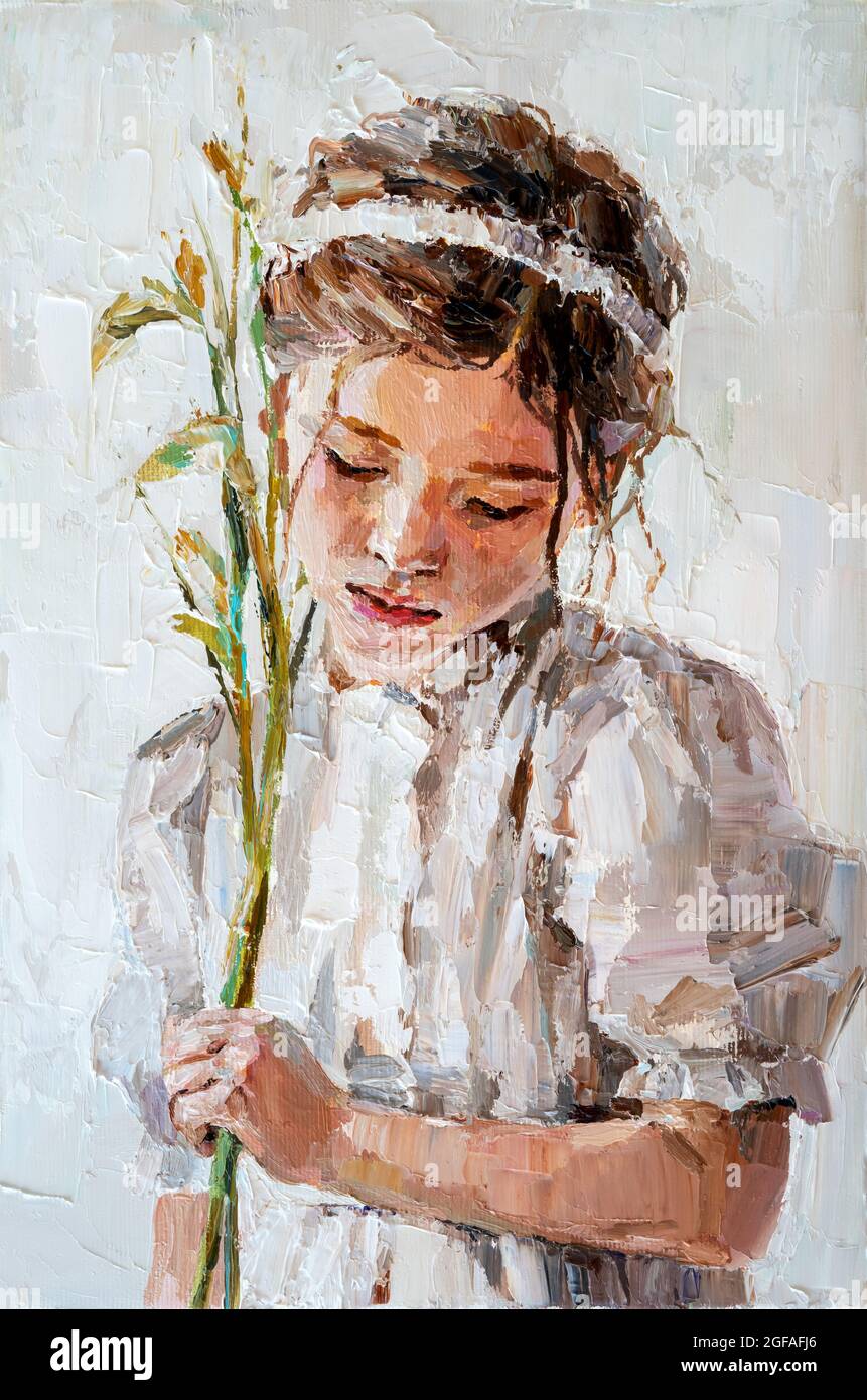 Girl with a flower in her hand on a white background Stock Photo - Alamy