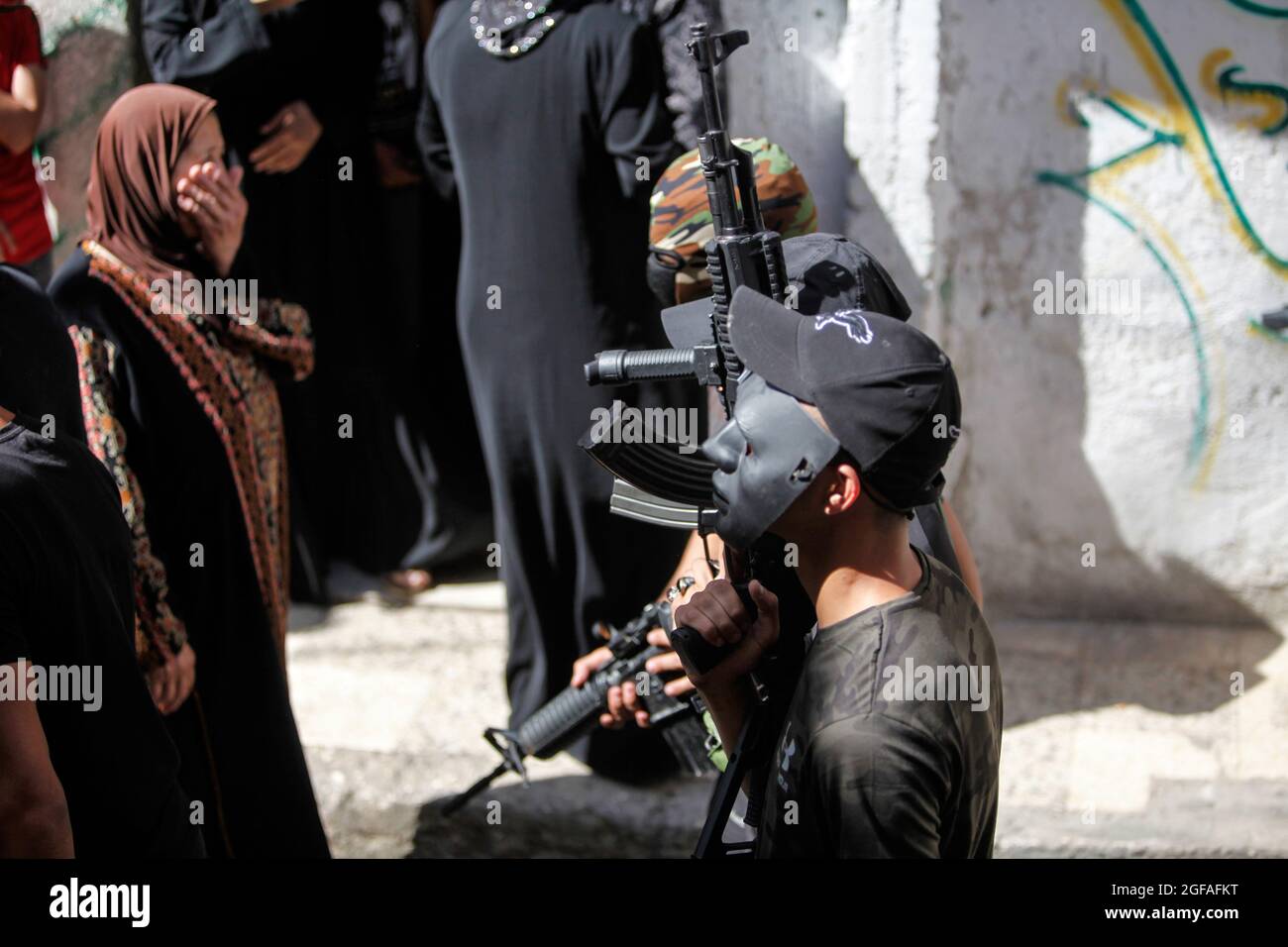Nablus, Palestine. 24th Aug, 2021. Palestinian masked gunmen attend the ...